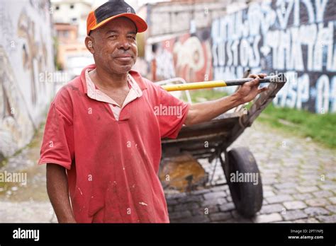 i keep this city clean portrait of a garbage collector with his cart