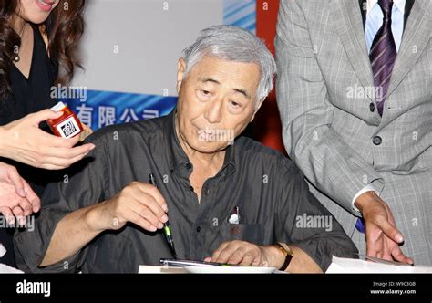 Japanese Writer Junichi Watanabe Signs For Fans During A Book Signing