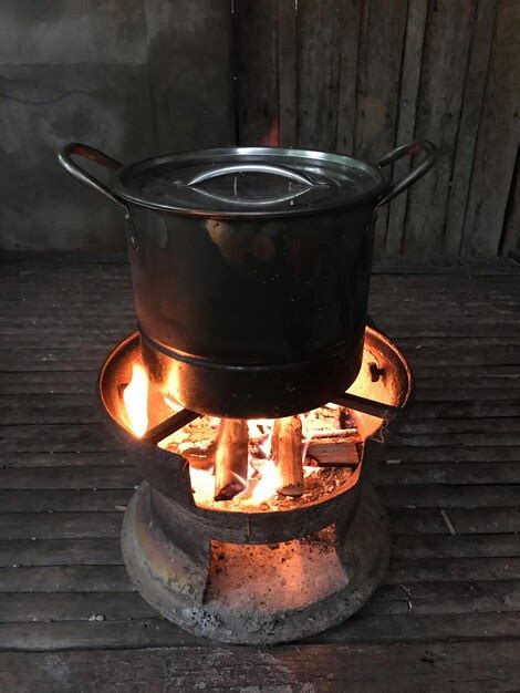 Premium Photo Close Up Of Fire In Container