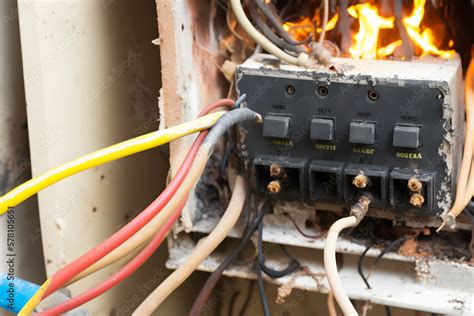 Burning Switchboard From Overload Or Short Circuit On Wall Circuit Breakers On Fire And Smoke