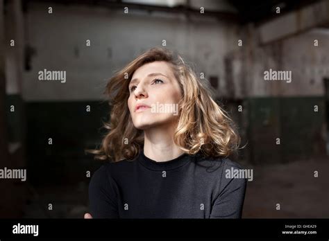 Beautiful Woman With A Serious Expression On Her Face Looking Straight