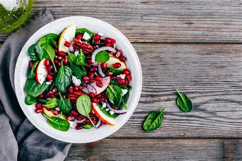 Green Spinach Salad With Apples Feta Cheese Pomegranate Seeds Red