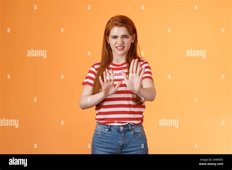 Gosh It Stinks Disgusted Redhead Picky Woman Blocking Sign Raise Hands Up Defensive Grimacing