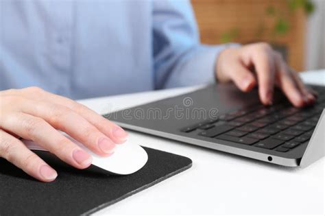 Woman Using Computer Mouse While Working With Laptop At White Table Closeup Stock Photo Image