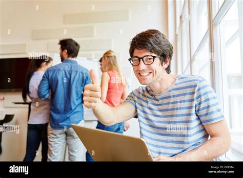 Nerd Babe Holding Thumbs Up With A Laptop Stock Photo Alamy