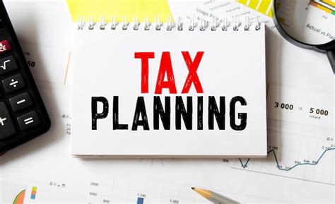 Premium Photo Text Tax Planning On White Paper Concept