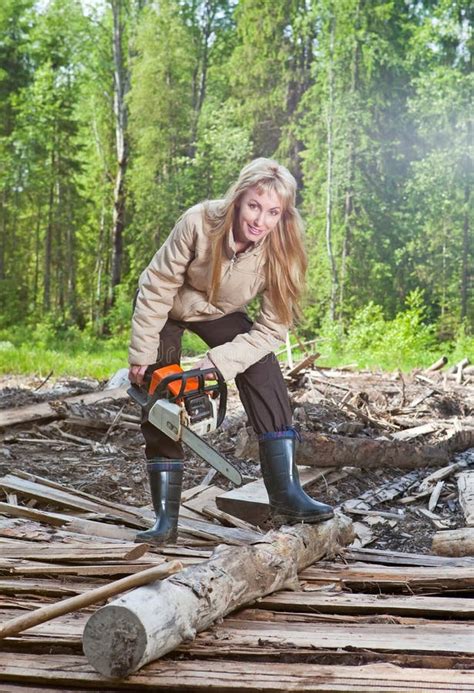 Woman In Wood Saws A Tree A Chain Saw Stock Image Image Of Forester Power