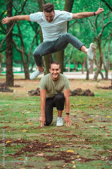 Gay Couple Jumping On Top Of Each Other Stock Photo Adobe Stock