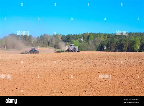Ploughing Tractor During Cultivation Agriculture Works At Field With