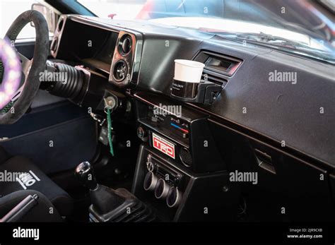 An Interior Of Toyota Corolla Sprinter Trueno Ae86 With A Cup Of Water