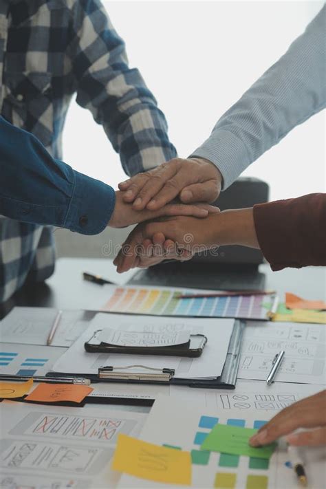 Close Up Ux Developer And Ui Designer Brainstorming About Mobile App Interface Wireframe Design