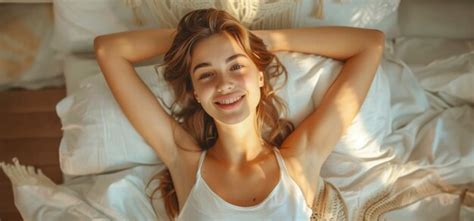Premium Photo A Woman Is Laying On A Bed With Her Arms Stretched Out