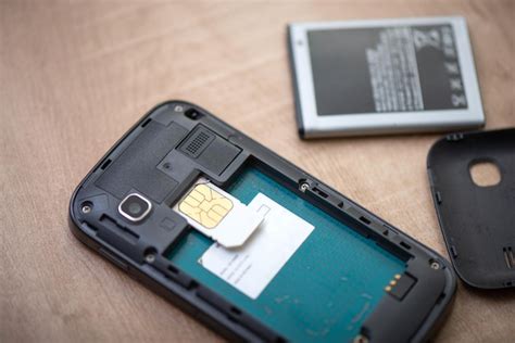 Premium Photo Sim Card For Smart Phone Changing The Sim Card