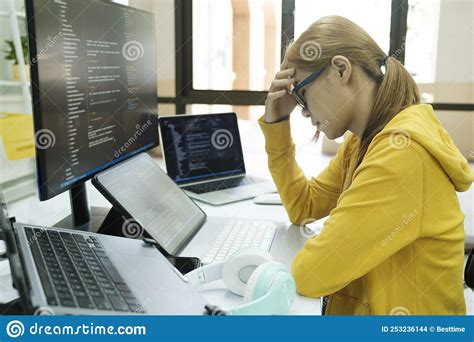 Young Woman Covering Her Face With The Stress Of Work Coding And Programming Software Stock