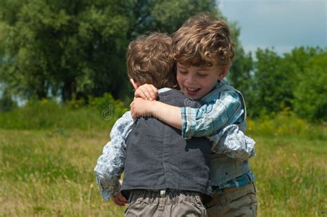 Twins Embrace Each Other To Hug Stock Image Image Of Smiling Clothes 54905703