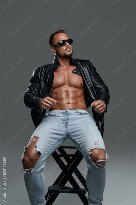 Plakat Handsome Male Model With Muscular Shirtless Torso Flashes A Wide
