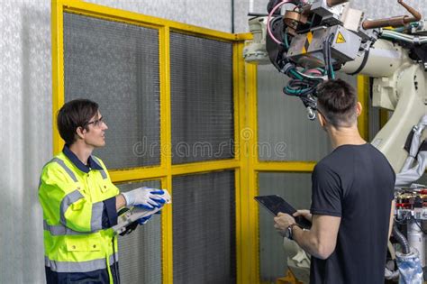 Technician Engineer Using Laptop Control Automation Robotics At