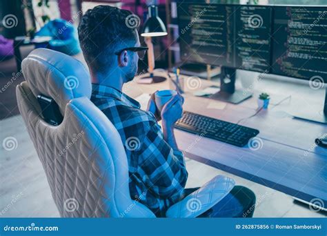 Photo Of Thoughtful Busy Programmer Wear Spectacles Drinking Tea