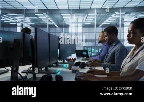 computer scientists in data center implementing ai predictive maintenance systems server farm