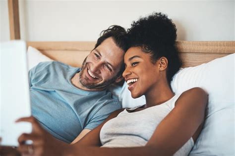 Premium Photo Happy Interracial Couple Relax And Bed For Selfie Photo