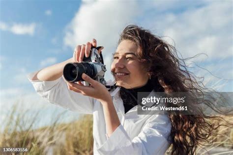 Woman Sitting Facing Camera Photos And Premium High Res Pictures