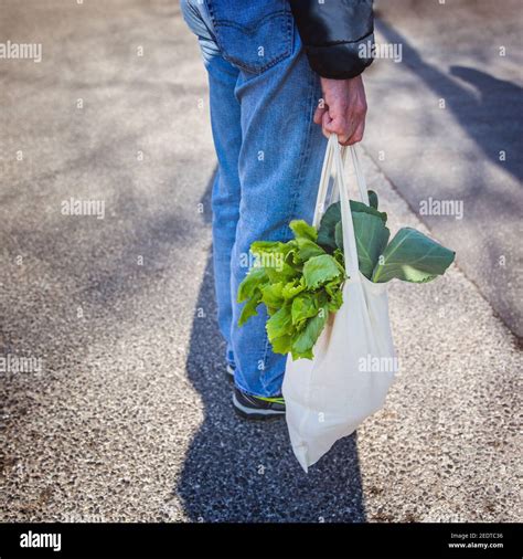 Fresh Leaves In Organic Bag In Man Hand Healthy Lifestyle Shopping