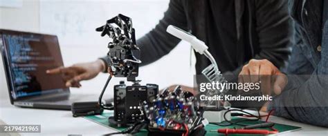 black and white male software developer programmers work together on