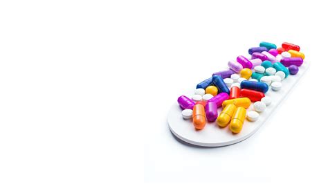 Premium Photo Lsd Tablets On White Multicolored Tablets And Capsules