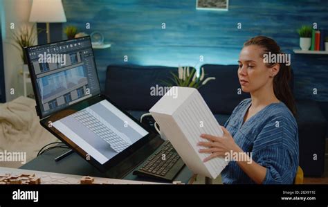 Young Engineer Designing Building Model For Construction Layout In Architectural Office