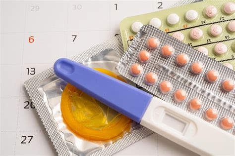 Pregnancy Test And Birth Control Pills On Calendar Contraception