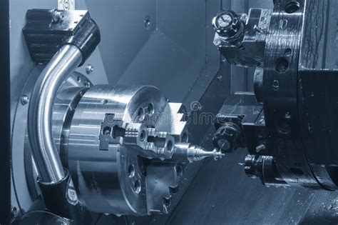 The CNC Lathe Machine Milling The Metal Shaft Parts By Milling Spindle Stock Photo Image Of
