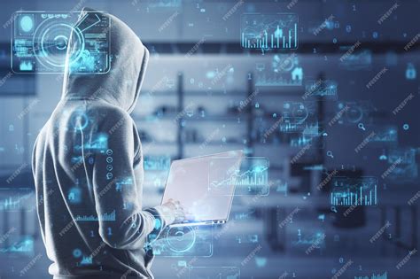 Premium Photo Hacker In Hoodie Using Laptop With Abstract Creative Business Charts And Binary