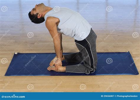 Man Doing Yoga On Mat Stock Image Image Of Activity 29656087
