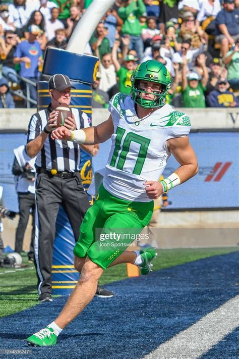 Oregon Ducks Quarterback Bo Nix Runs Through The Endzone After In