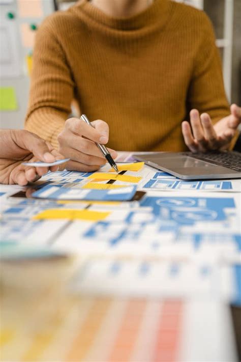 Ux Ui Developer And Ui Designer Brainstorming About Mobile App Interface Wireframe Design With