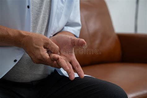 Elderly Asian Male Patients Suffer From Numbing Pain In Hands From