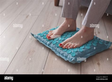 Female Feet Standing On Acupressure Mat Self Acupuncture Massage Woman Having Alternative