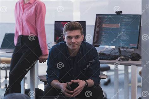 Programming Man Working On Computer In It Office Sitting At Desk