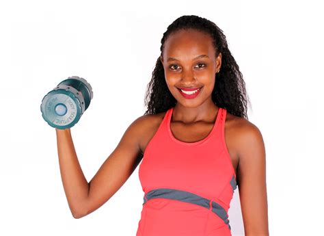 Beautiful Woman Lifting Dumbbell With One Arm High Quality Free Stock Images
