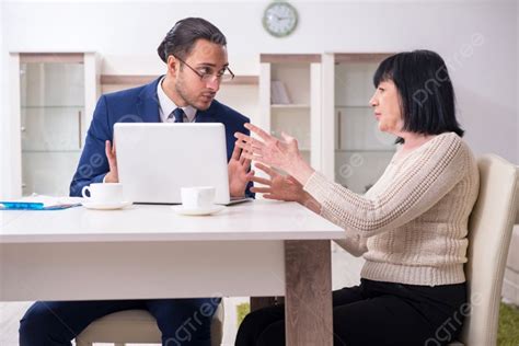 The Male Real Estate Agent And Female Client In The Apartment Male Real Estate Agent And Female