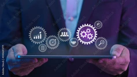 Businessman Showing Virtual Screen Of Gear Cog Icon Present Operation Management Involving