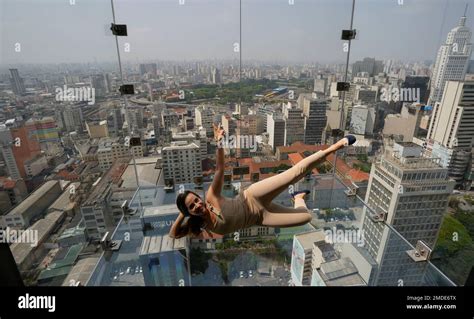 A Visitor Poses For At The Sampa Sky Lookout Made Entirely Of Glass On
