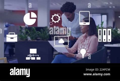 Business Icons Animation Over Colleagues Discussing Documents In Modern
