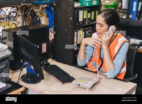 Engineer Woman Technician Staff Working Product Parts Stock Customer Support On Call In Back