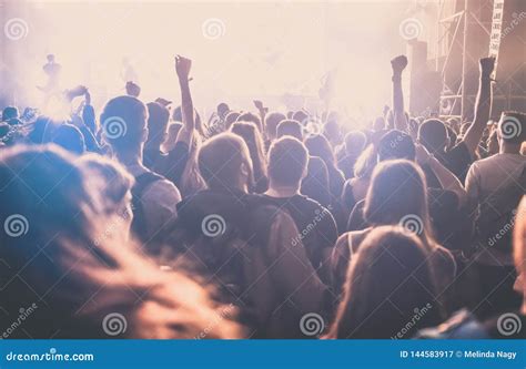 Cheering Crowd With Raised Hands At Concert Music Festival Editorial
