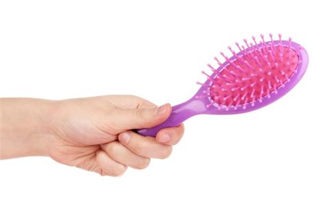 Premium Photo Purple Hair Brush In The Hand Isolated On White