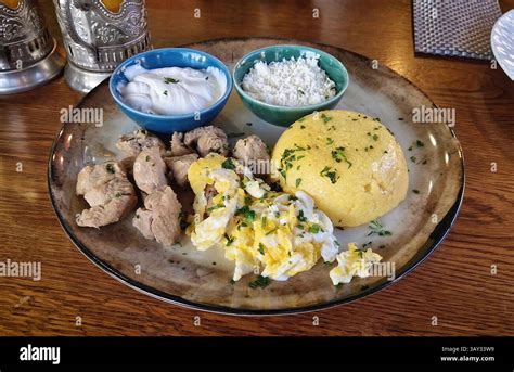 Traditional Moldovan Food Meal Closeup With Pork Stew Mamaliga