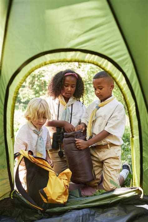 Group Of Scouts Camping Together In Forest Lit By Sunlight Stock Image Image Of Excursion