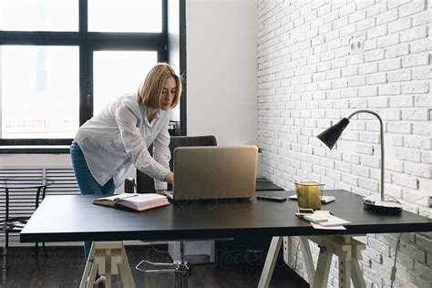 Babe Blonde Woman Switching Off Laptop By Stocksy Contributor Danil Nevsky Stocksy