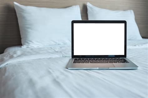 Premium Photo Mock Up Blank Screen Laptop On The Bed For Advertising And Text